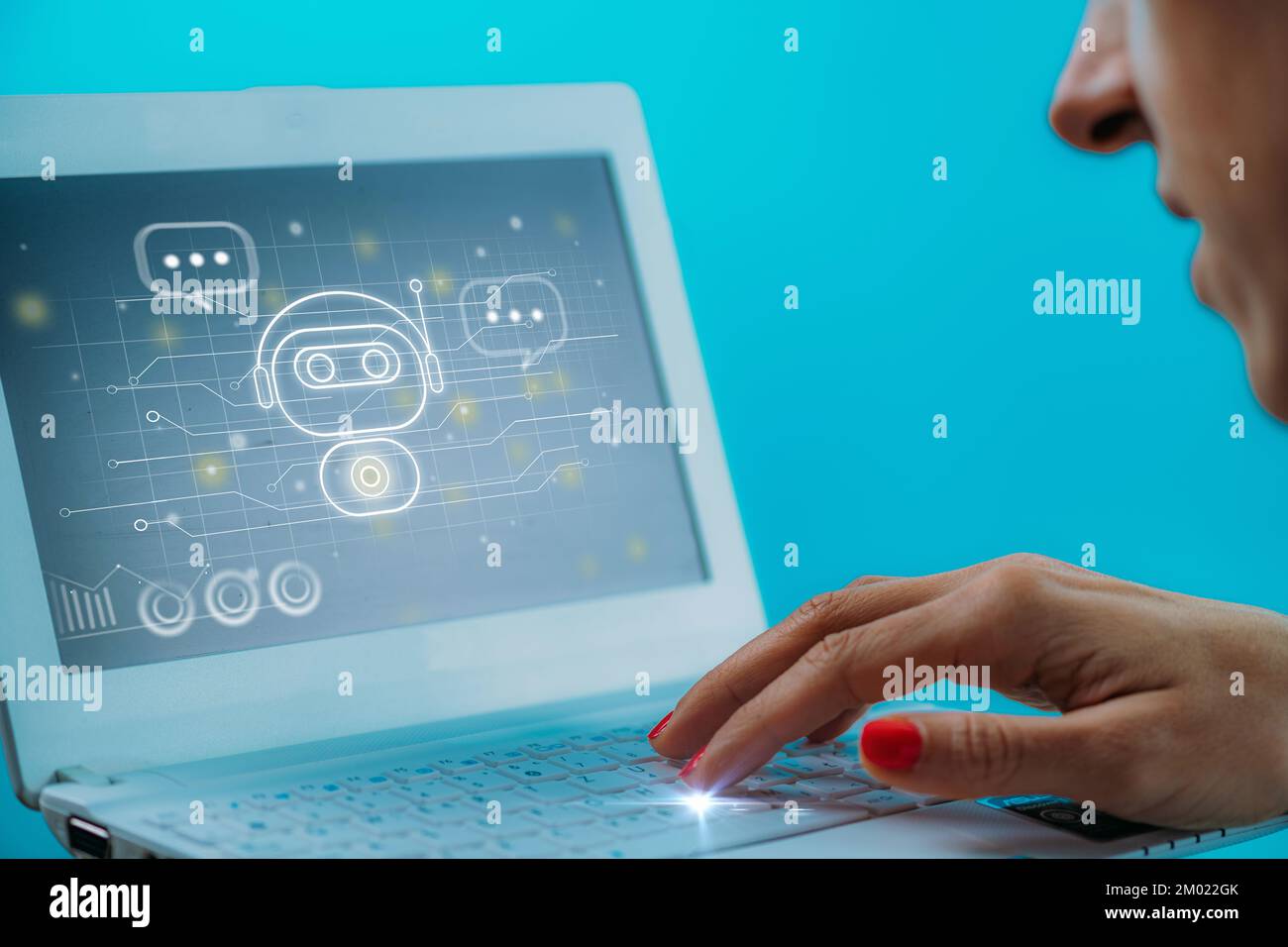 Woman using a chatbot on her laptop Stock Photo - Alamy