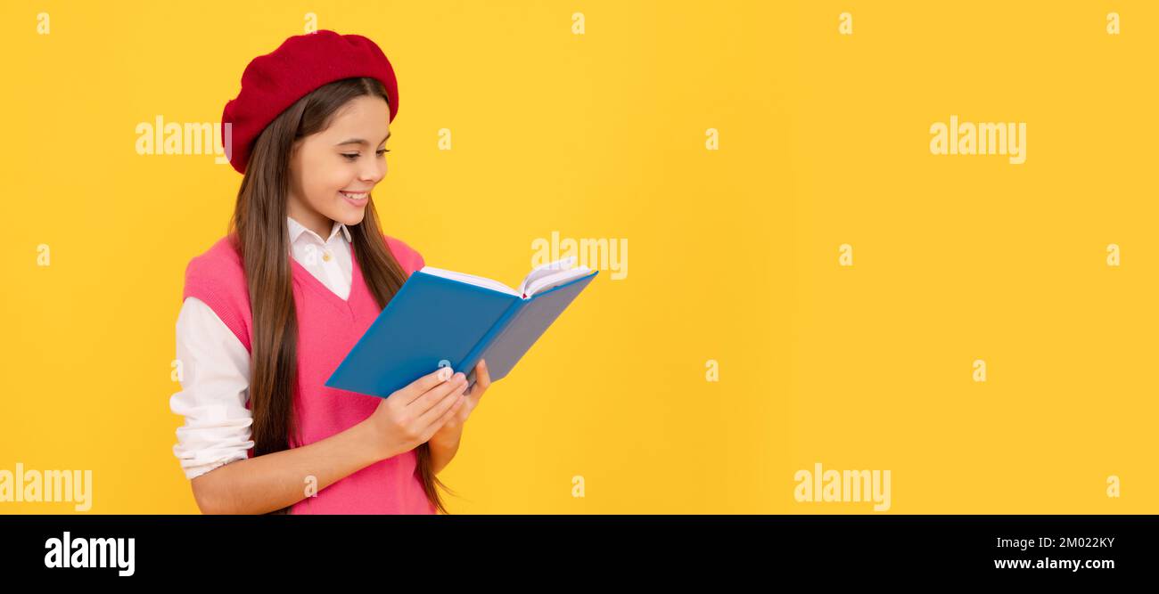 happy teen school girl in french beret reading book on yellow ...