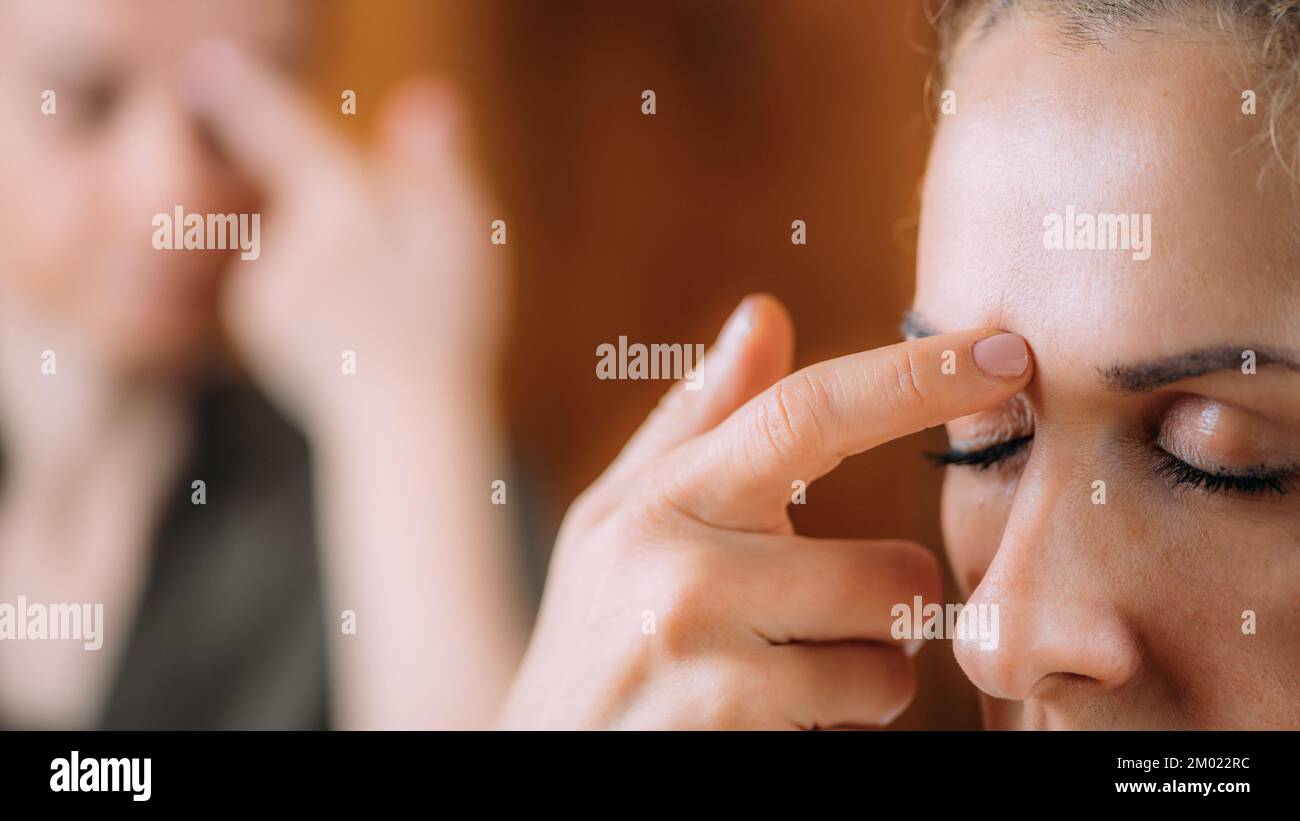 EFT finger tapping technique Stock Photo - Alamy