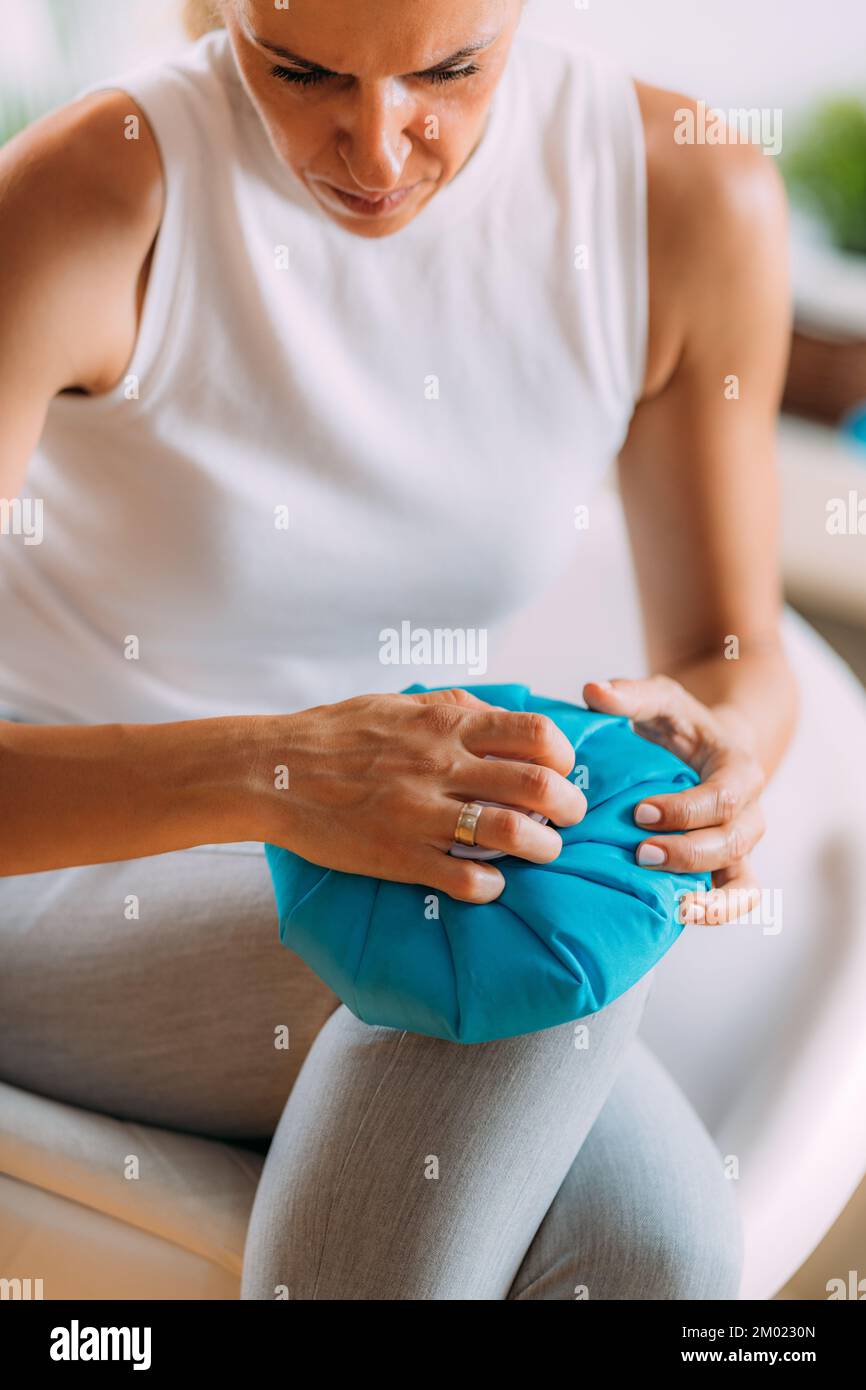 Woman ice pack leg hi-res stock photography and images - Alamy