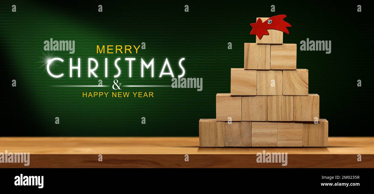 Wooden Christmas tree (made of small wooden cubes) with a red comet ...