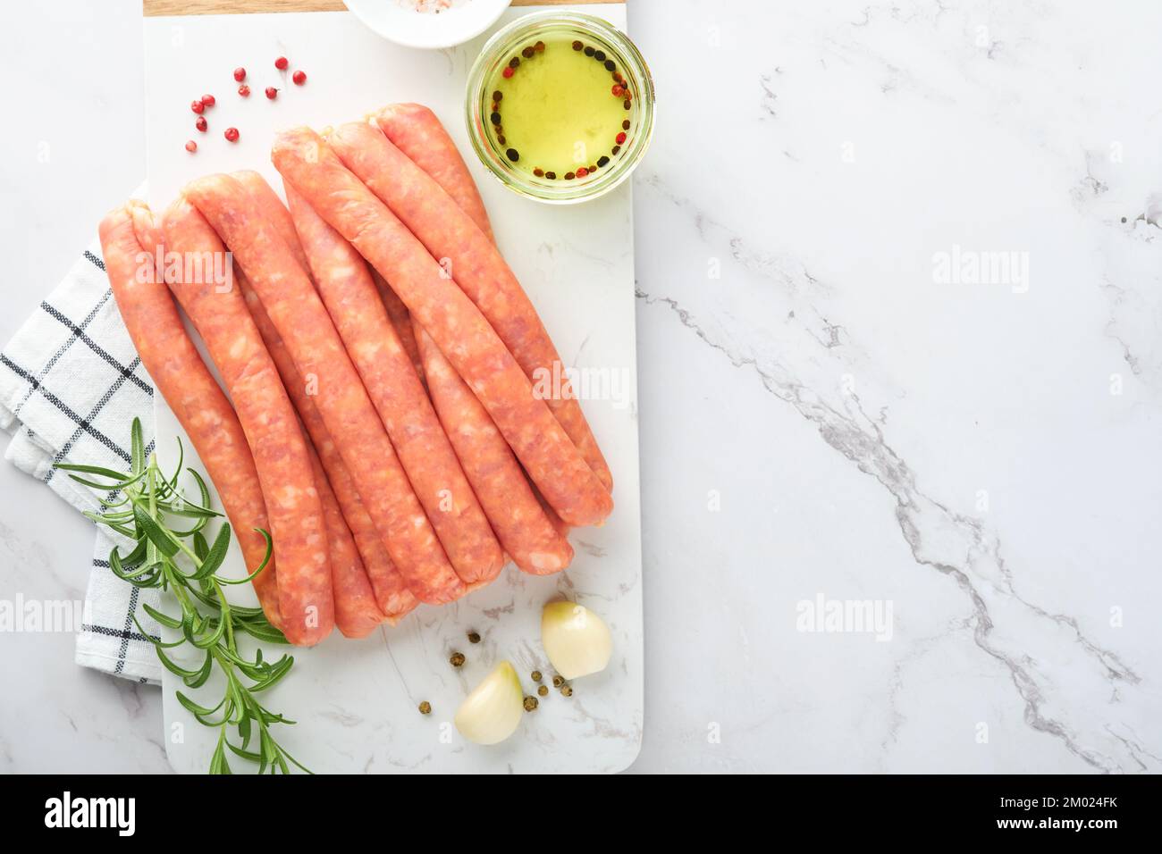Meat beef sausages. Raw barbecue sausages with spices, vegetables and ...