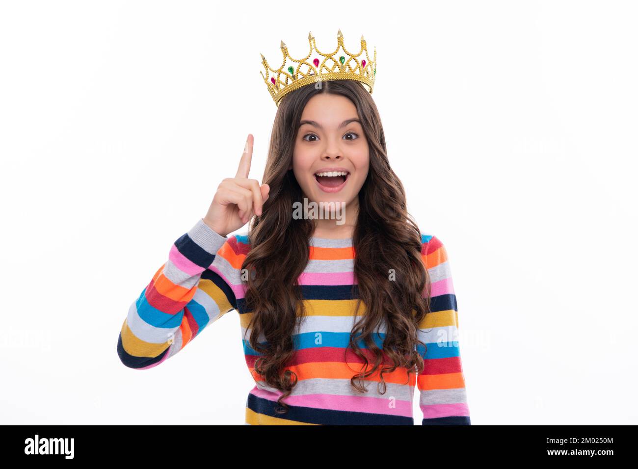 Little queen wearing golden crown. Teenage girl princess holding crown ...