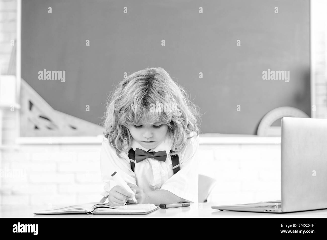 concentrated teen boy in classroom. back to school. knowledge day ...