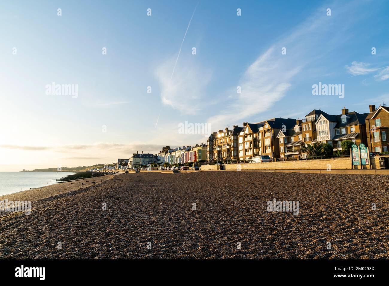 The central Parade and stone beach at Herne Bay seafront on a early ...