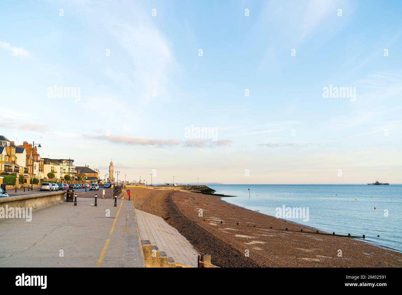 The central Parade and stone beach at Herne Bay seafront on a early ...