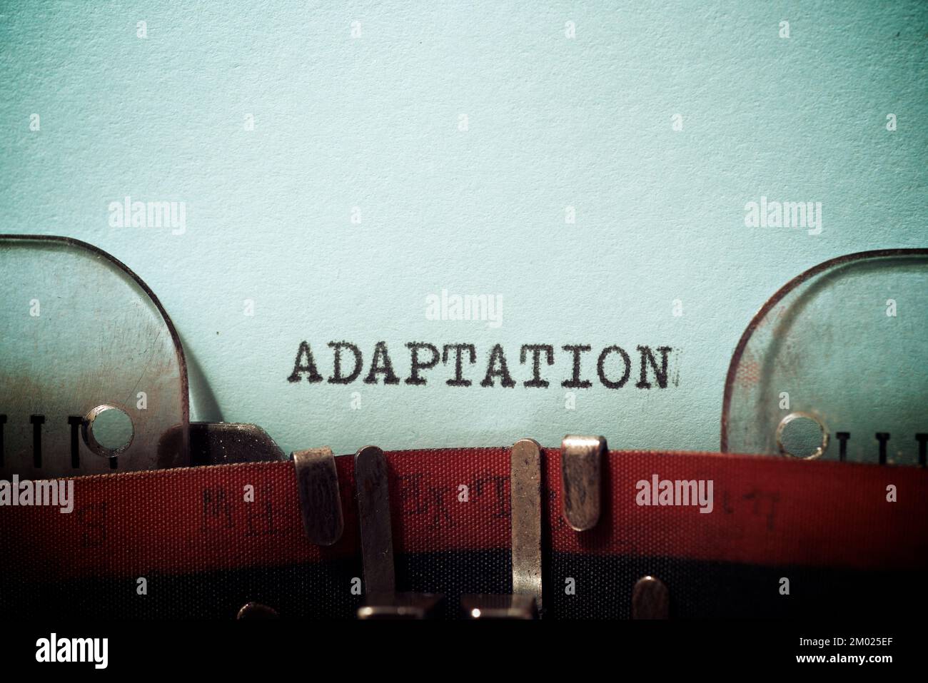 Adaptation word written with a typewriter Stock Photo - Alamy