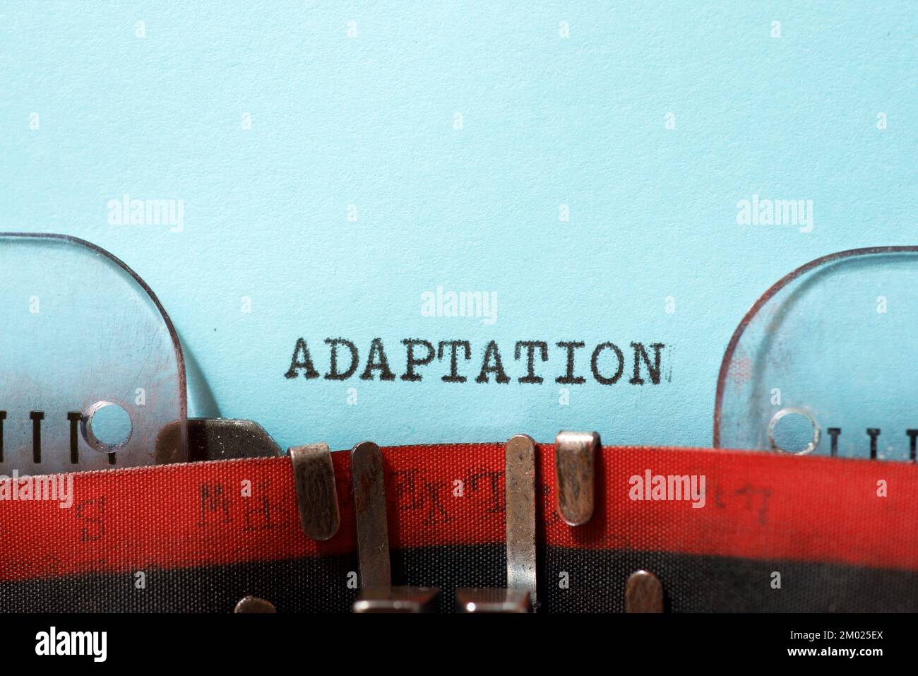 Adaptation word written with a typewriter Stock Photo - Alamy