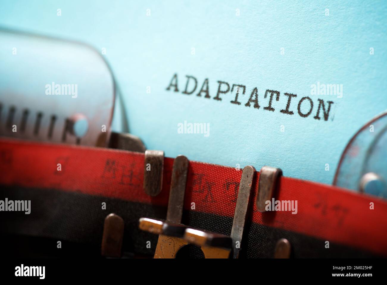 Adaptation word written with a typewriter Stock Photo - Alamy