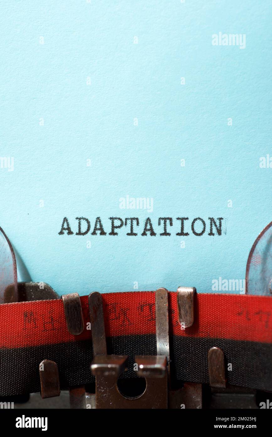 Adaptation word written with a typewriter Stock Photo - Alamy