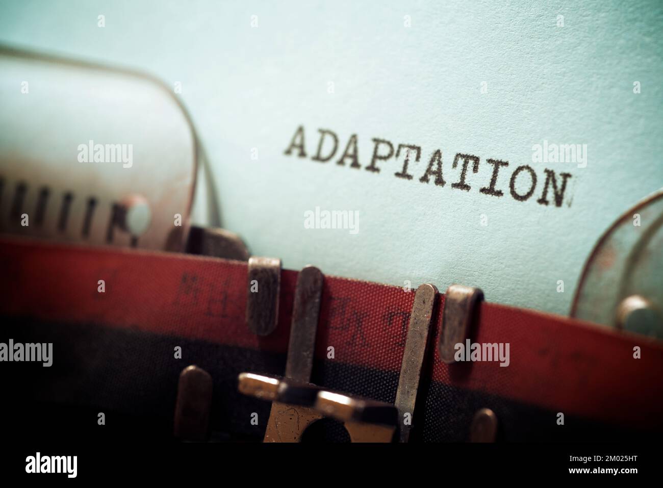 Adaptation word written with a typewriter Stock Photo - Alamy
