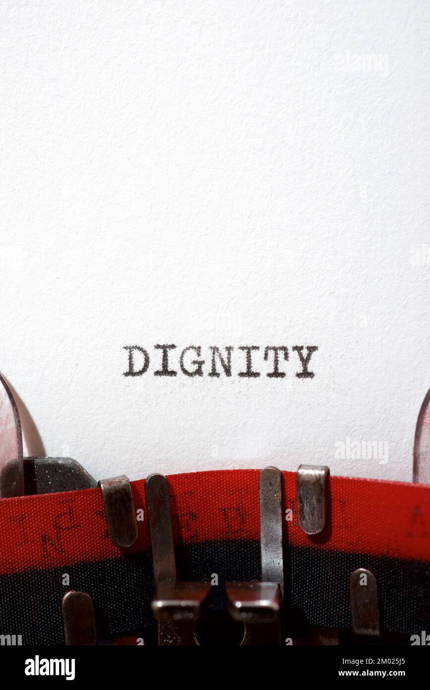 Dignity text written with a typewriter Stock Photo - Alamy