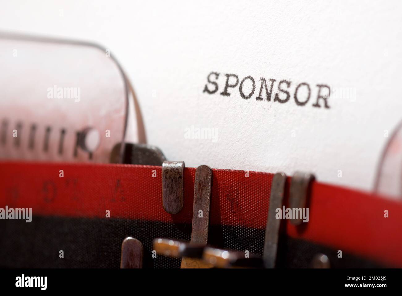 Sponsor text written with a typewriter Stock Photo - Alamy