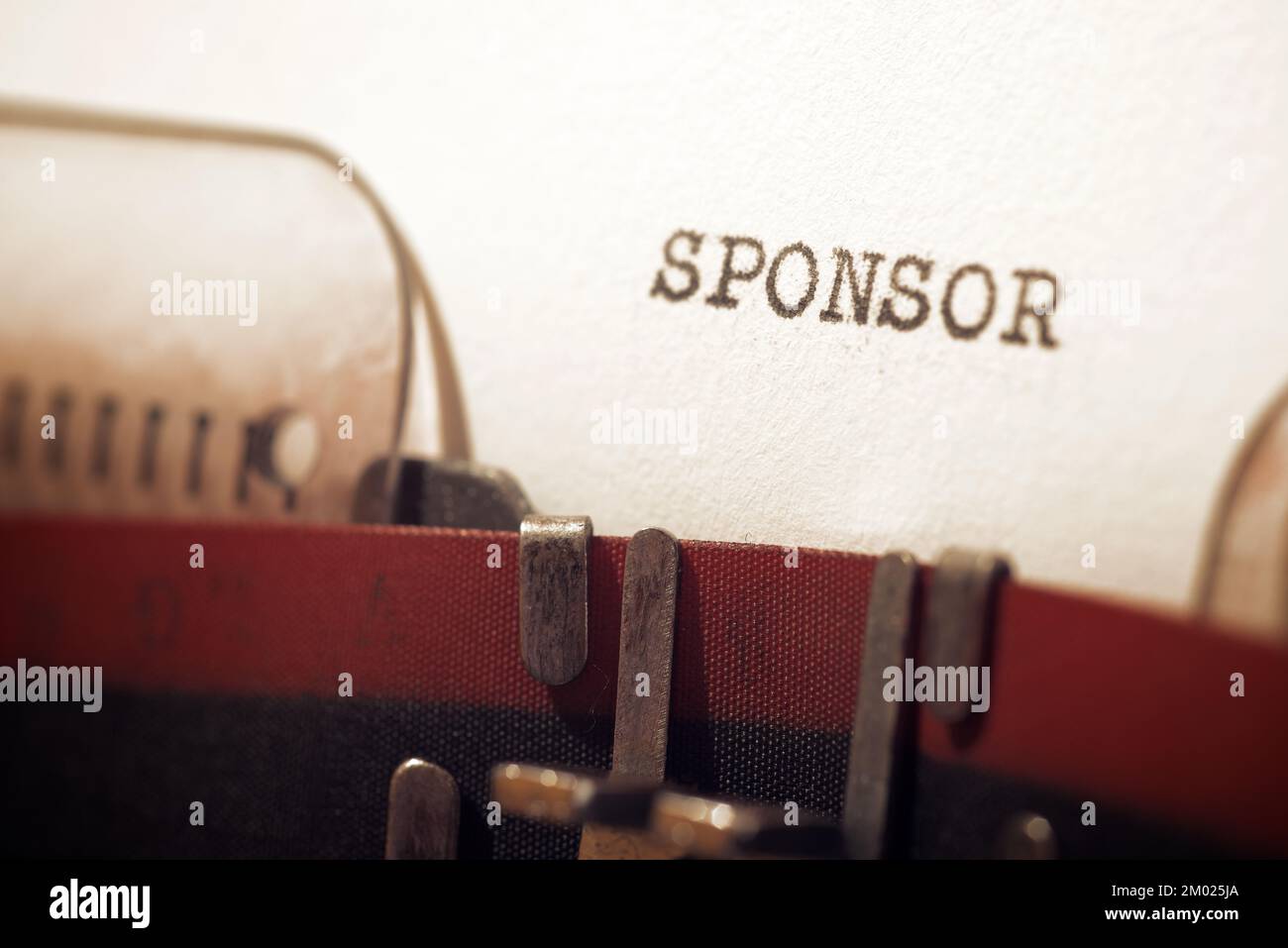 Sponsor text written with a typewriter Stock Photo - Alamy