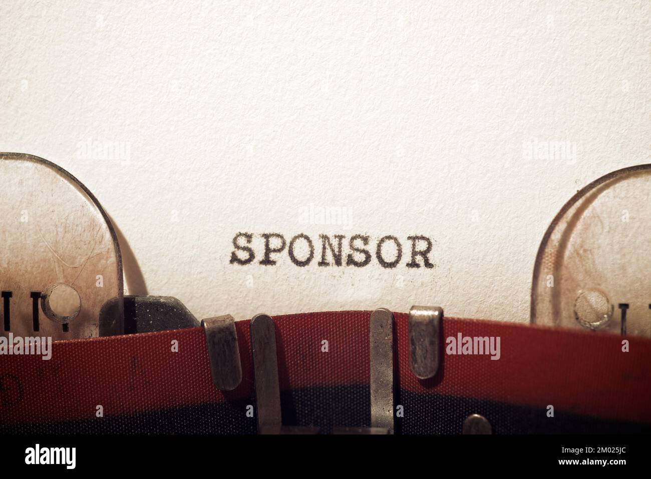 Sponsor text written with a typewriter Stock Photo - Alamy