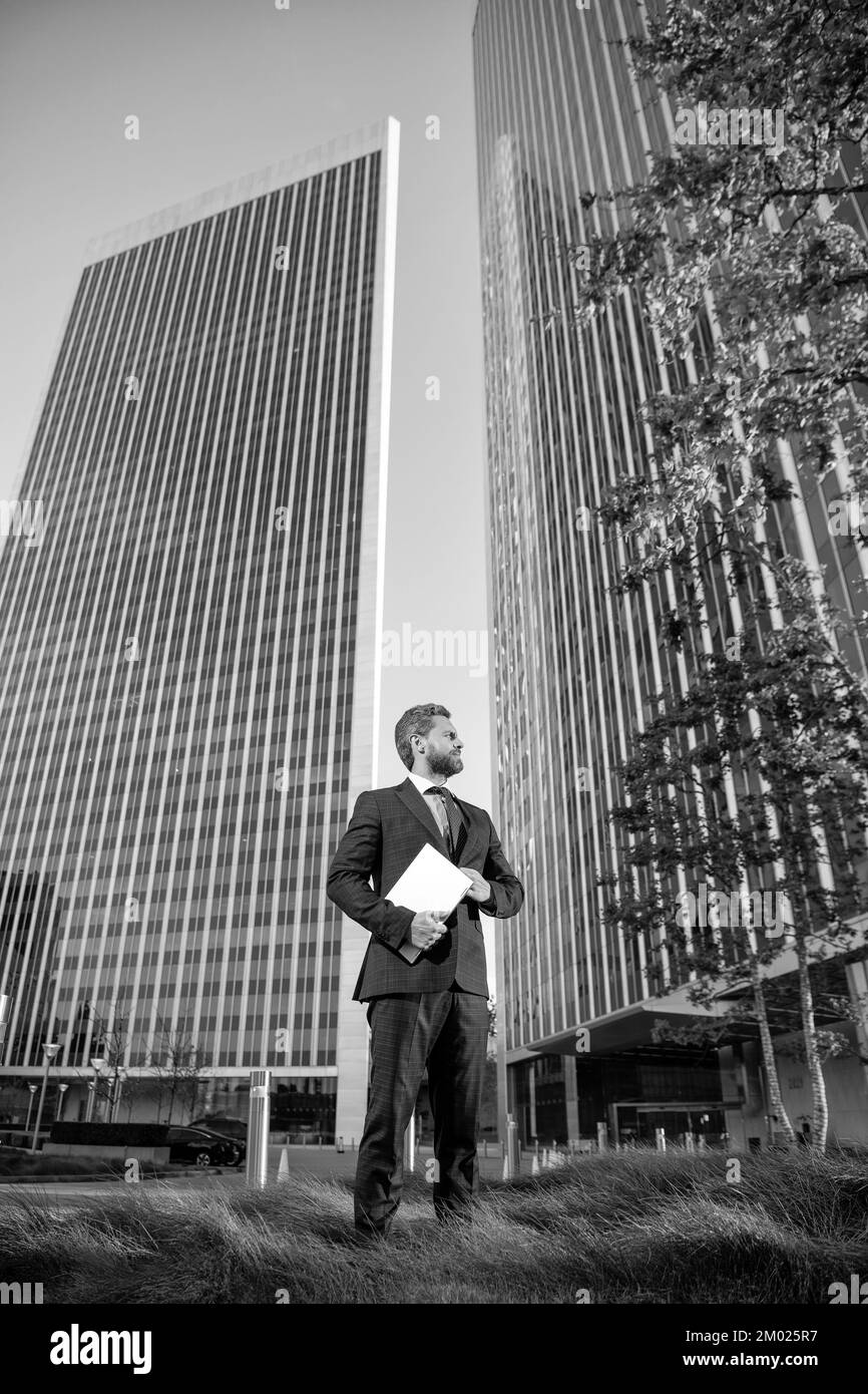 entrepreneur. agile business. professional network administrator hold computer. boss with modern ...