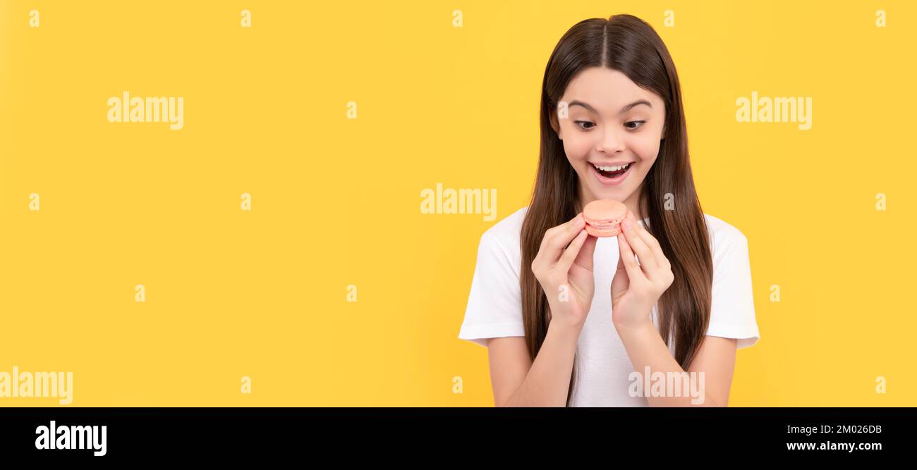 surprised child with dessert bakery. surprised kid hold french macaron ...