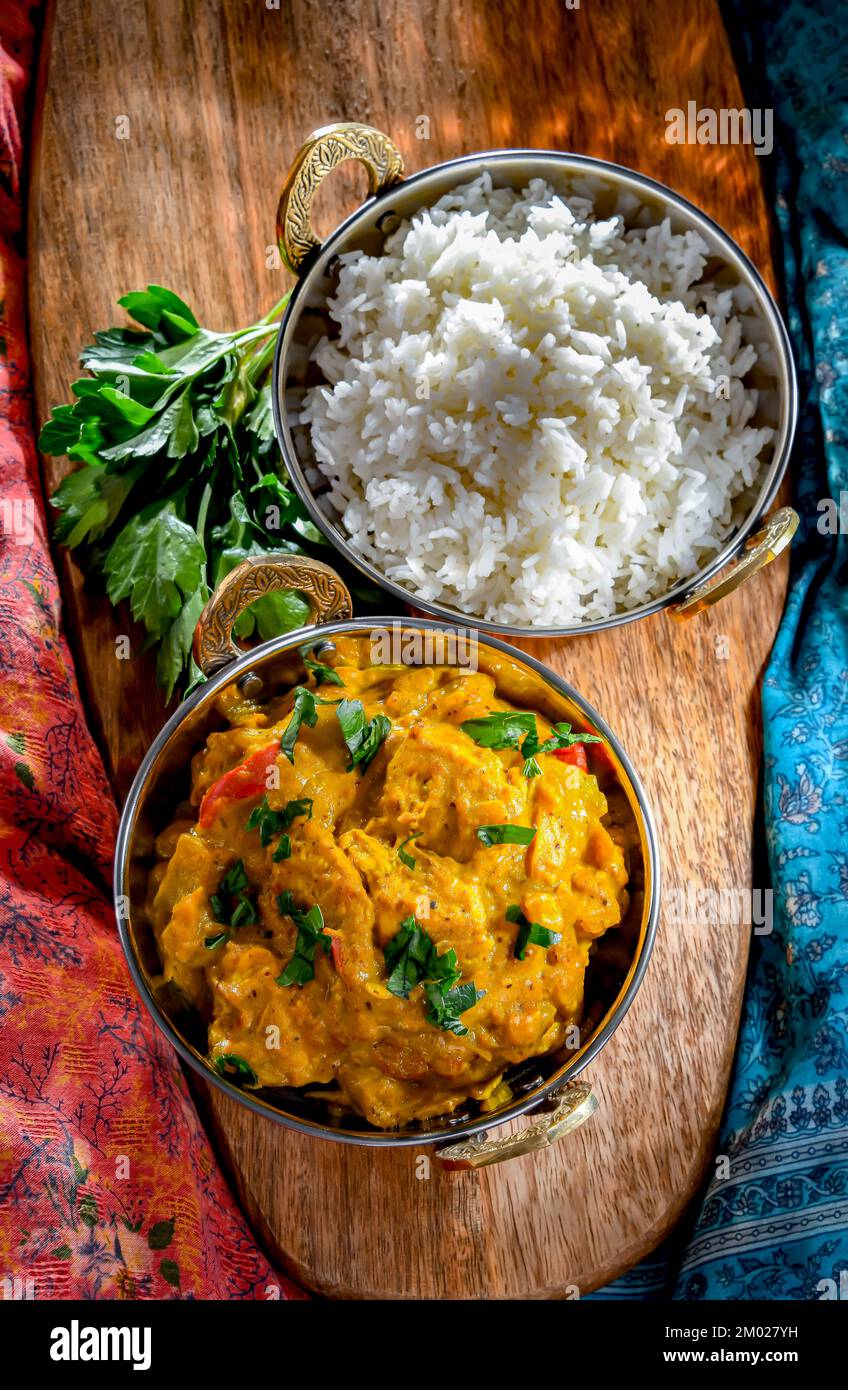 Curry chicken with rice served in original indian karahi pots Stock ...