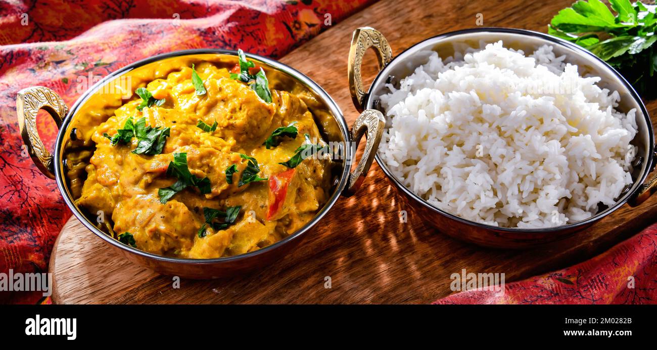 Curry chicken with rice served in original indian karahi pots Stock ...