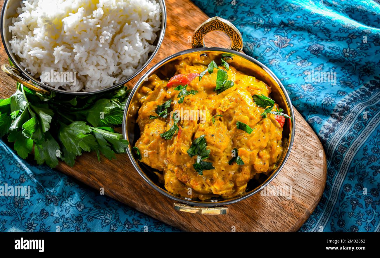 Curry chicken with rice served in original indian karahi pots Stock ...