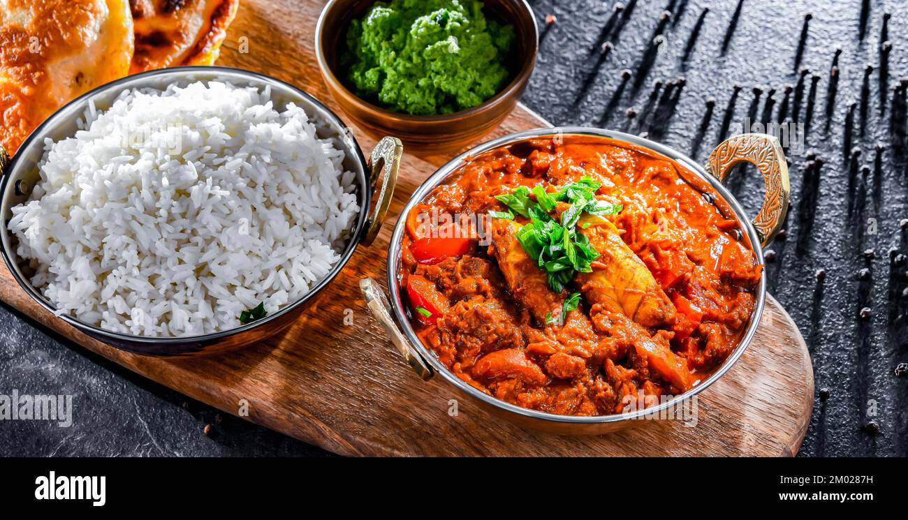 Butter chicken with rice and naan flatbread served in original indian ...