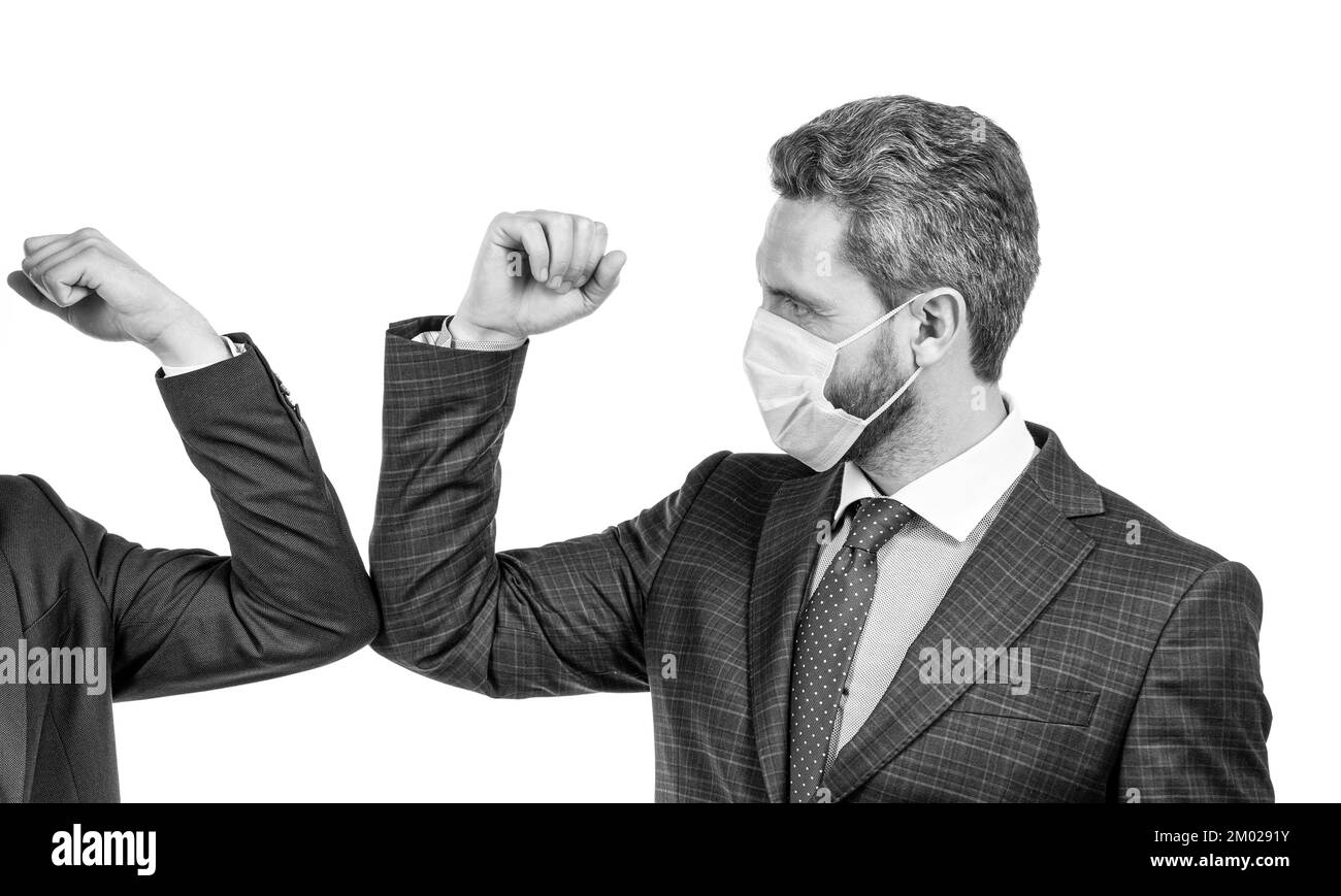 Man lawyer in face mask touch elbows with colleague using coronavirus ...