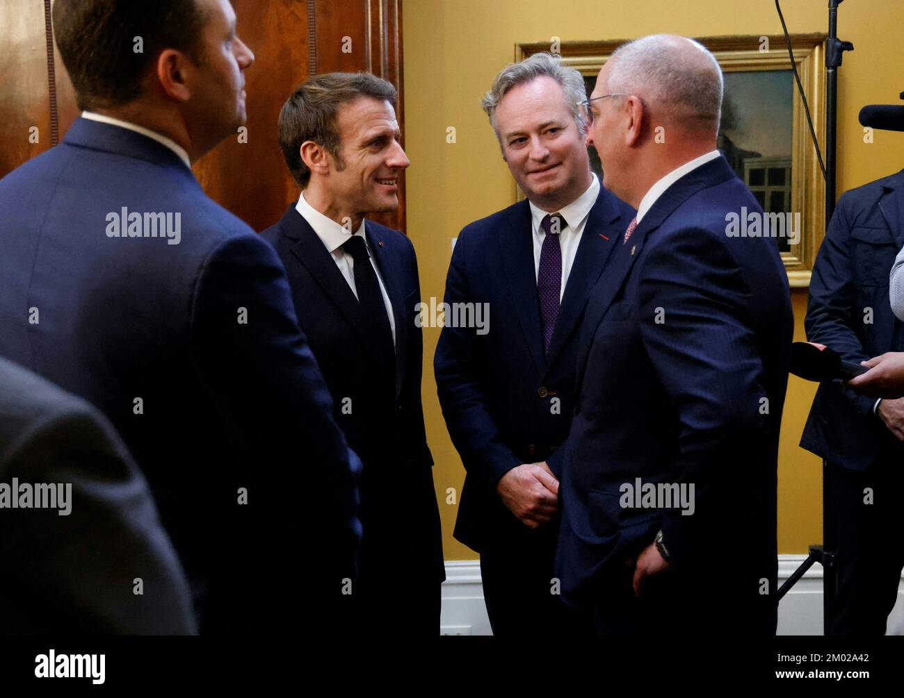 French President Emmanuel Macron (2-L) speaks with Louisiana Govenor ...