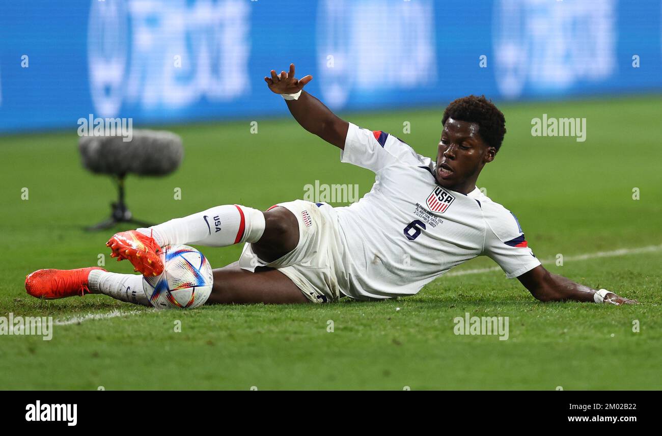 Doha, Qatar. 3rd Dec, 2022. Yunus Musah of USA keeps the ball in play ...