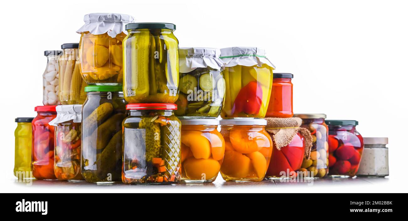 Jars with variety of marinated vegetables and fruits. Preserved food ...