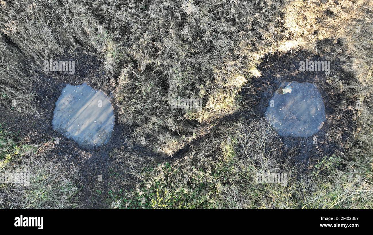 Puddle swamp dig spade worker man drone aerial puddle protection ...