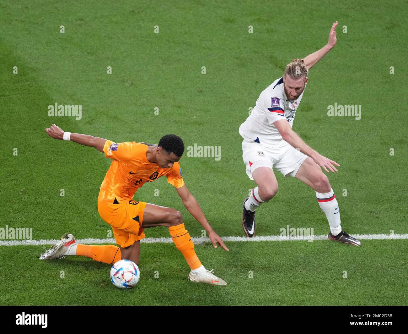 Doha, Qatar. 3rd Dec, 2022. Cody Gakpo (L) of the Netherlands vies with ...