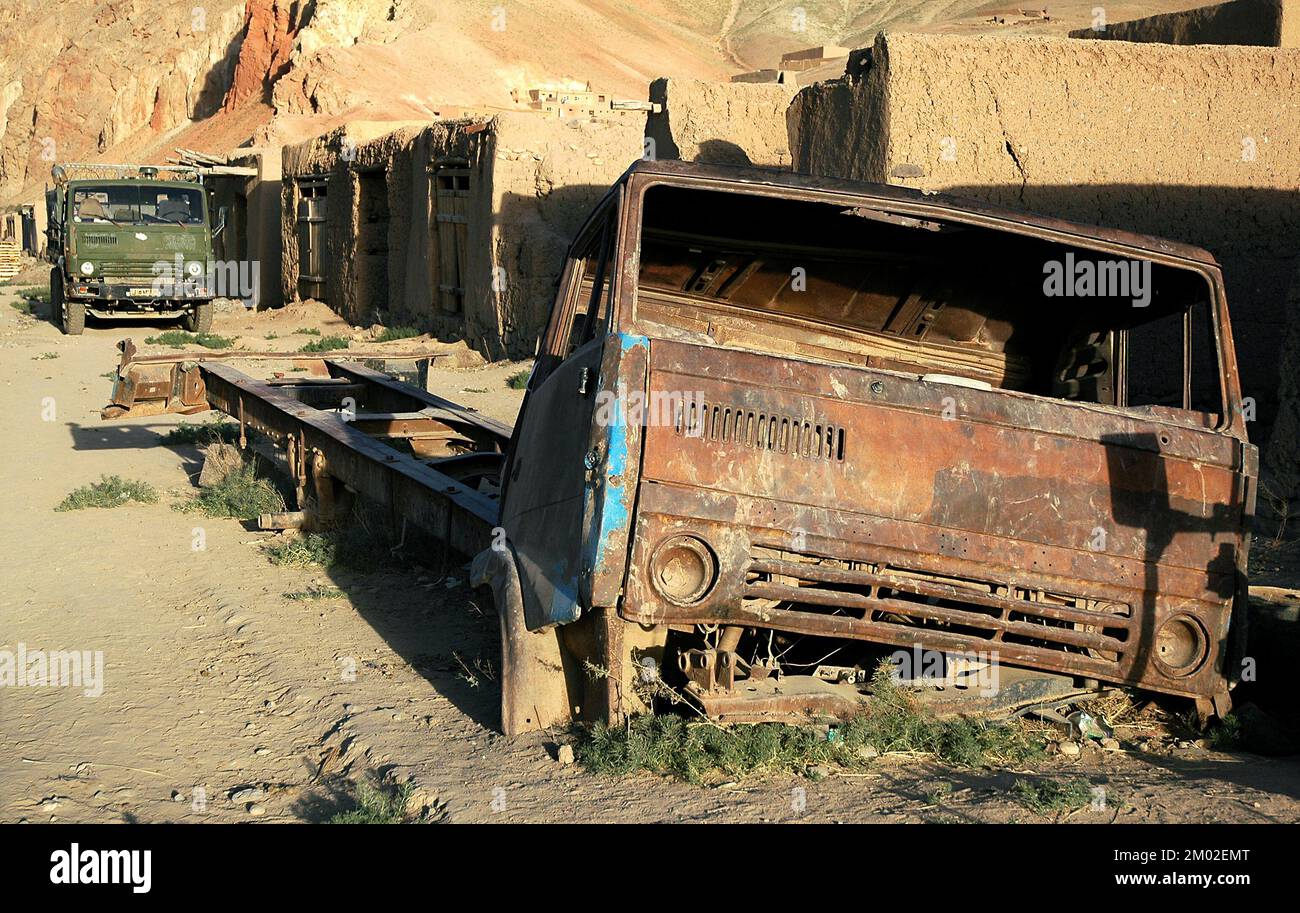 A rusting old truck is abandoned by the roadside in Yakawlang in ...