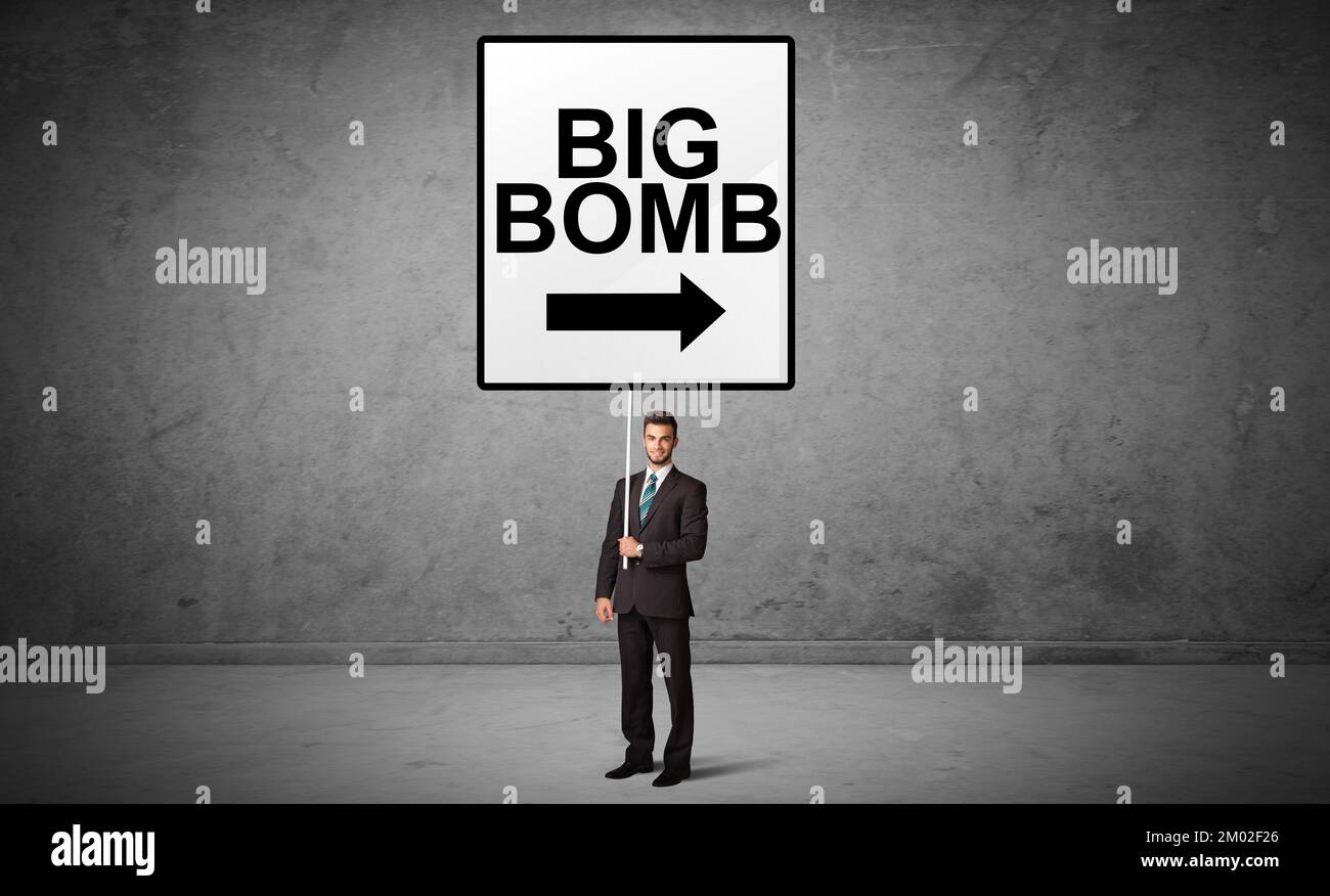 business person holding a traffic sign Stock Photo - Alamy