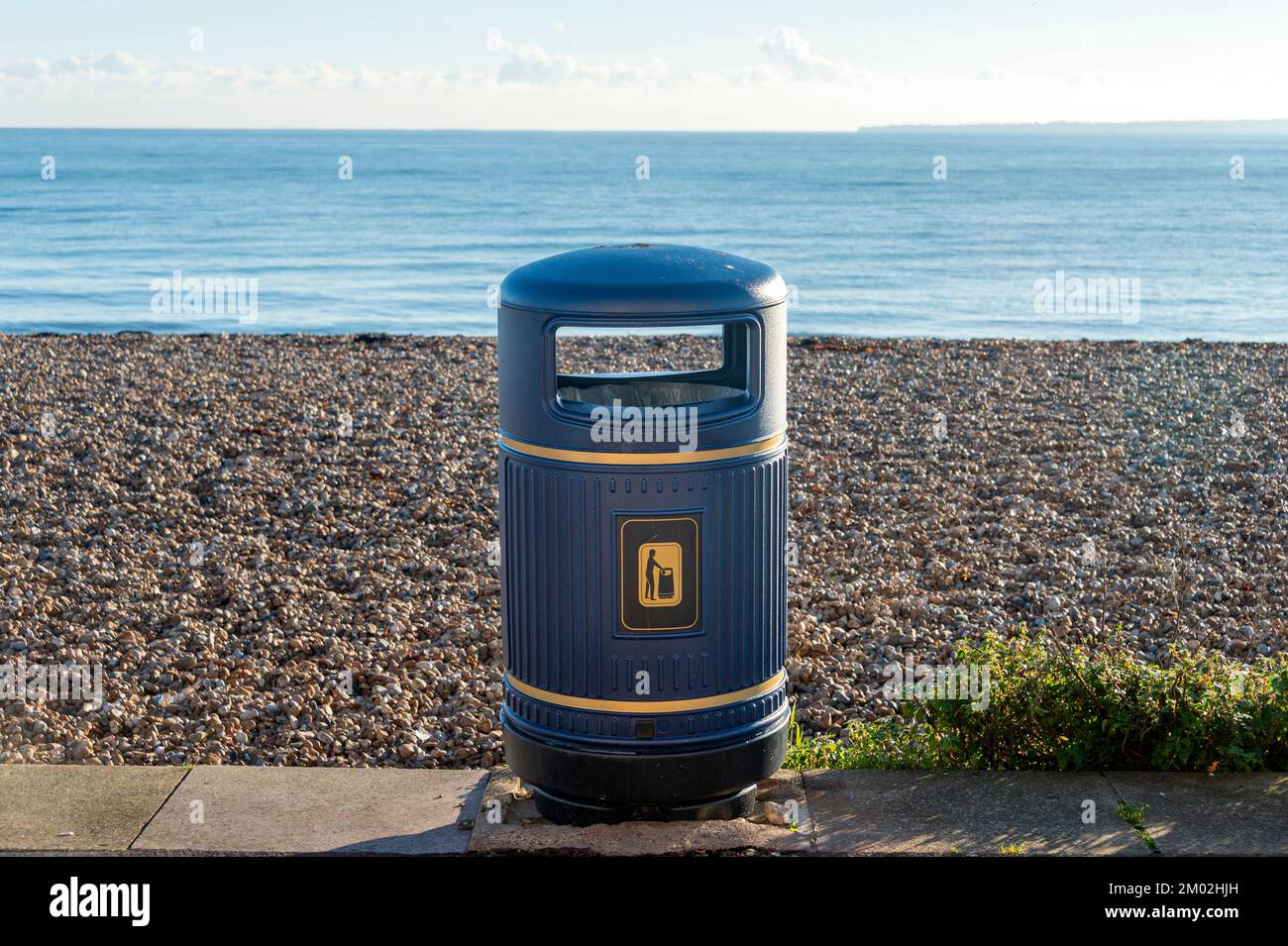 Blue trash can on the seafront at Southsea, Hampshire, UK. Waste ...