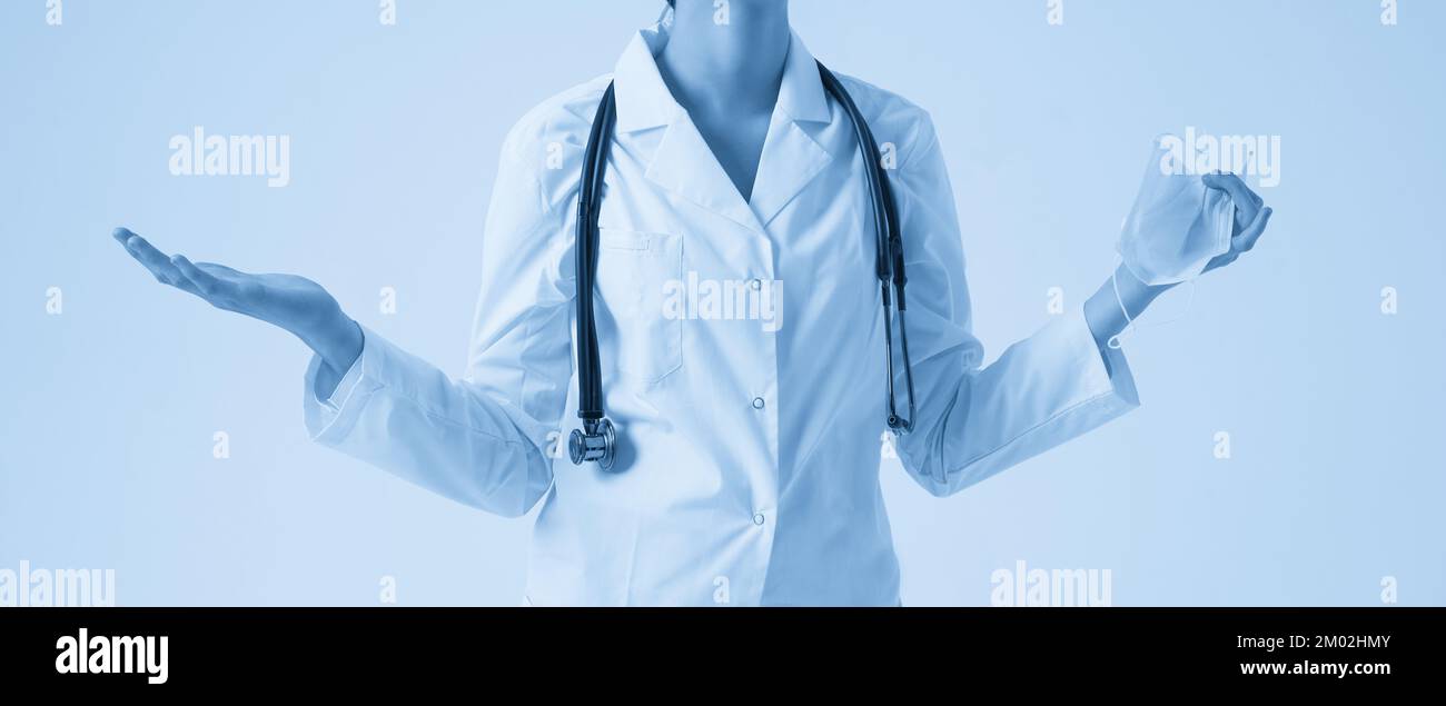 Happy glad Doctor wearing face mask looking at measurement on medical ...