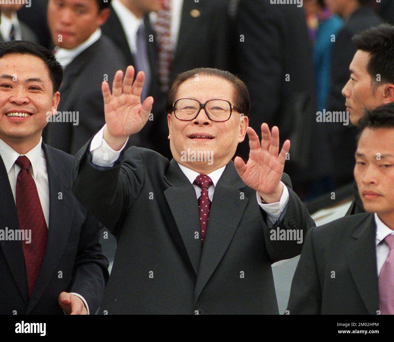 Chinese President Jiang Zemin waves on June 30, 2002 as he arrives at ...