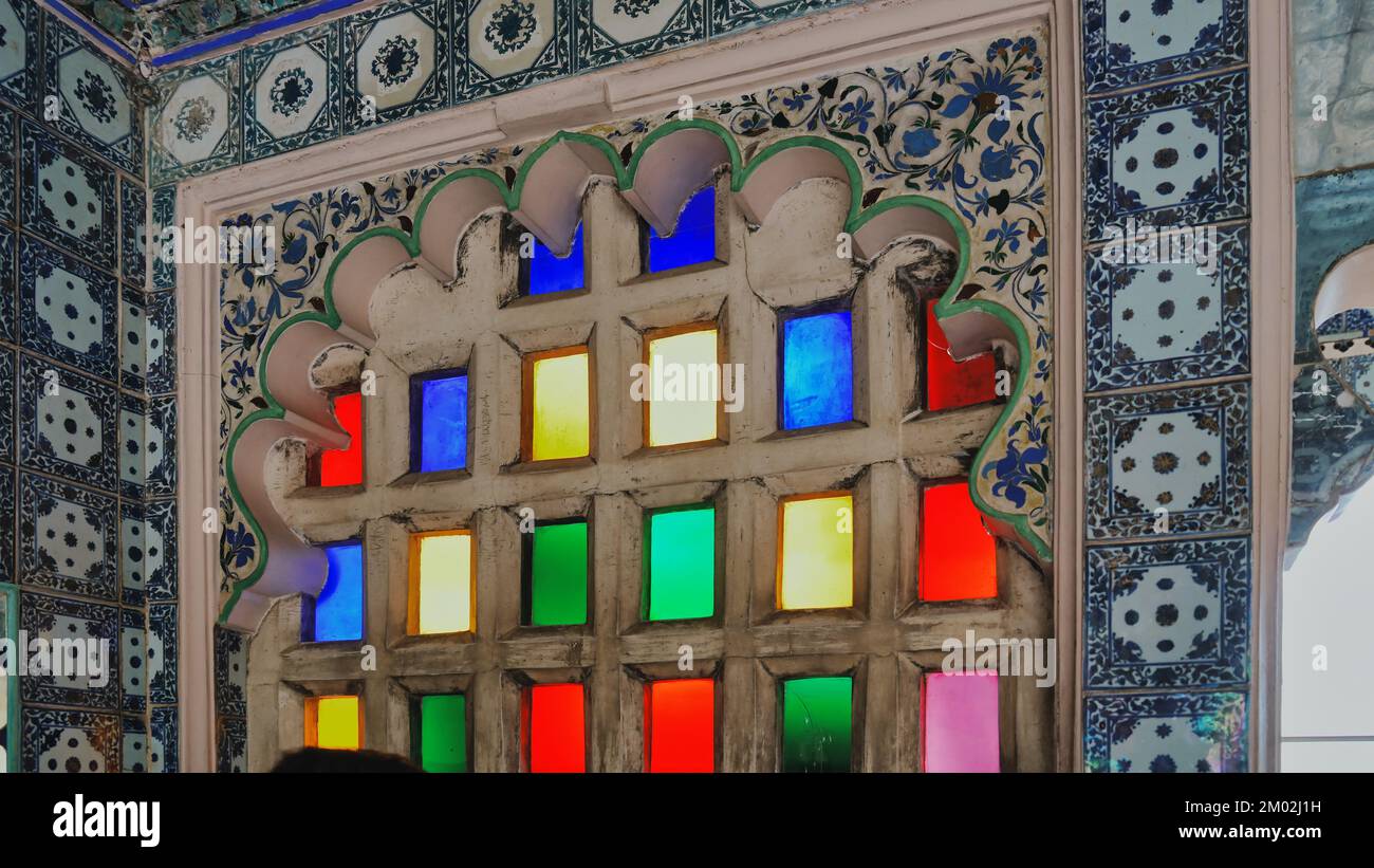 City Palace colorful window view in Udaipur, Rajasthan, India. People ...
