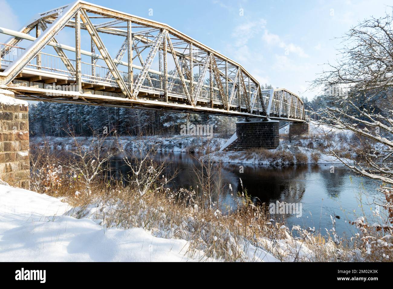 sunny winter landscape with iron construction bridge, Valmiera, Latvia ...