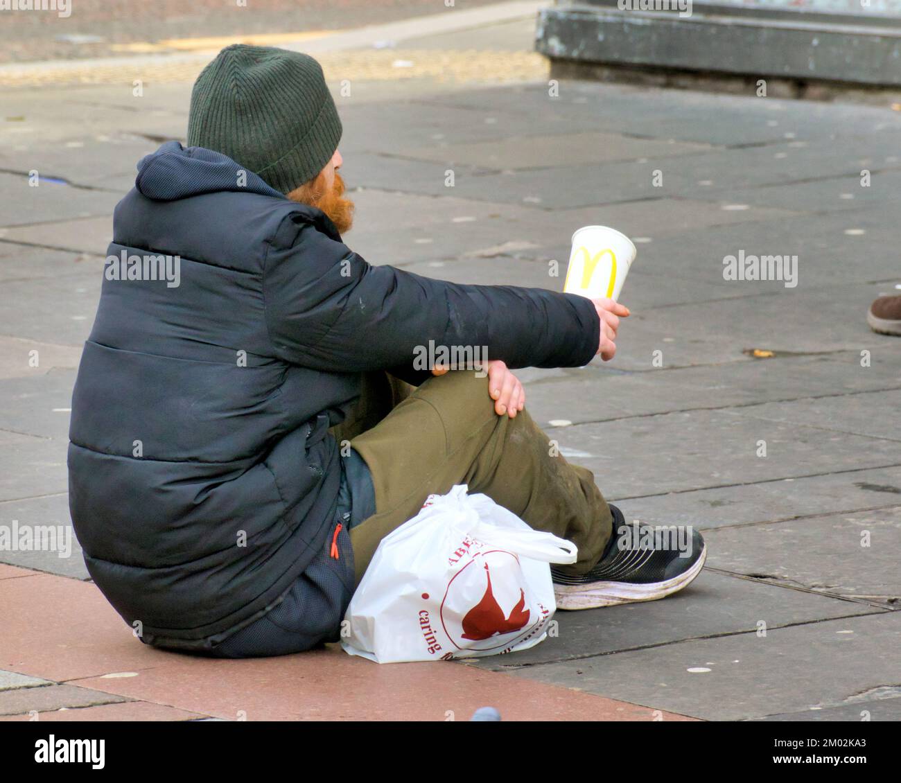 homeless man begging on the style mile of Scotland Buchanan street ...