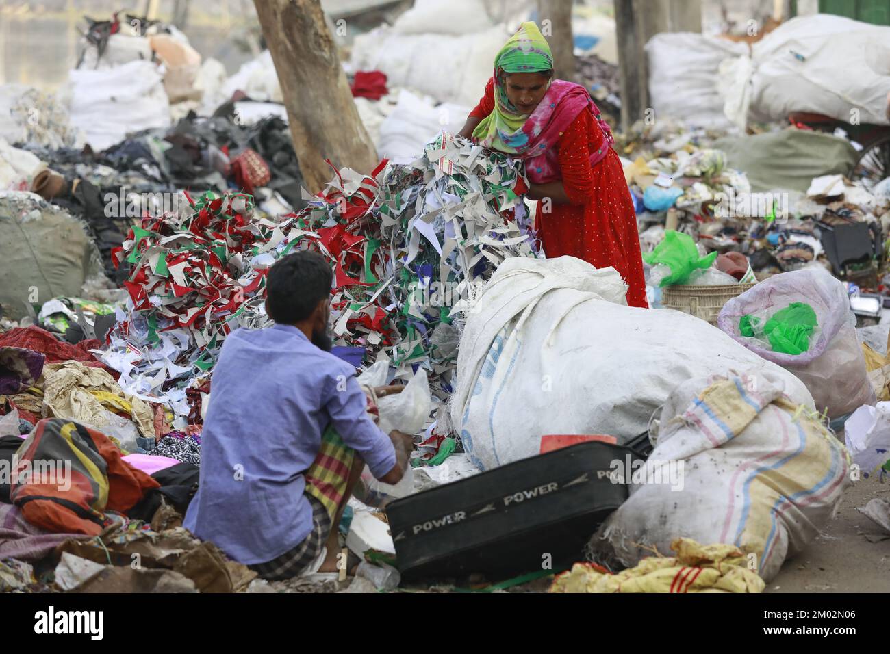 Dhaka, Bangladesh. 3rd Dec, 2022. A Bangladeshi woman looks for plastic ...