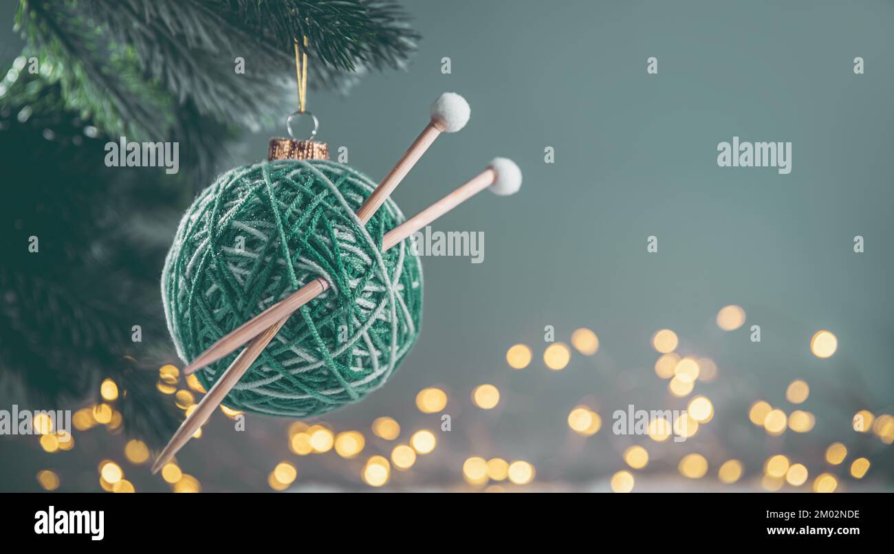 green Christmas ball in the form of a ball of threads with spokes on ...