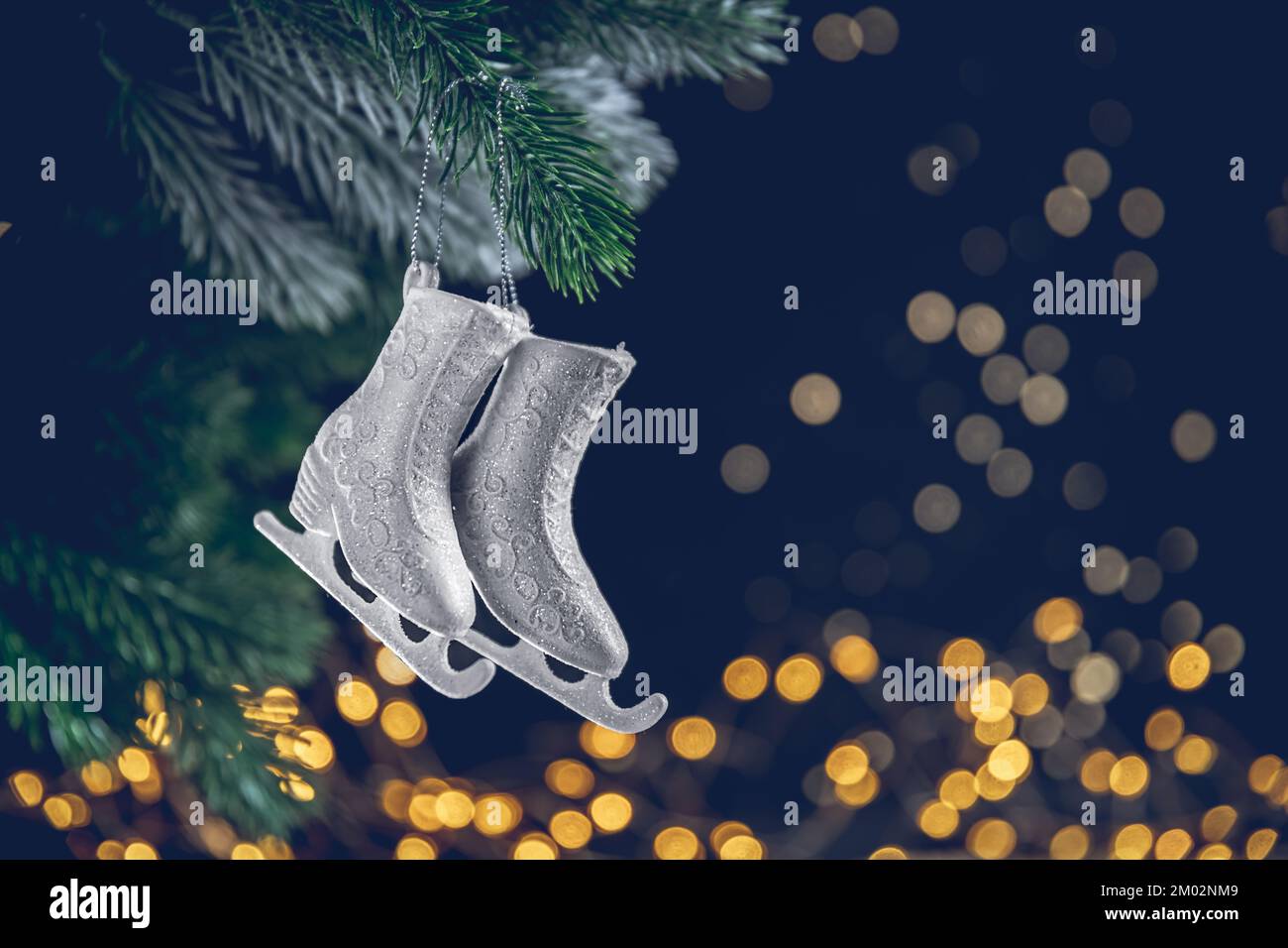 Christmas tree toy in the form of skates for figure skating hangs on ...