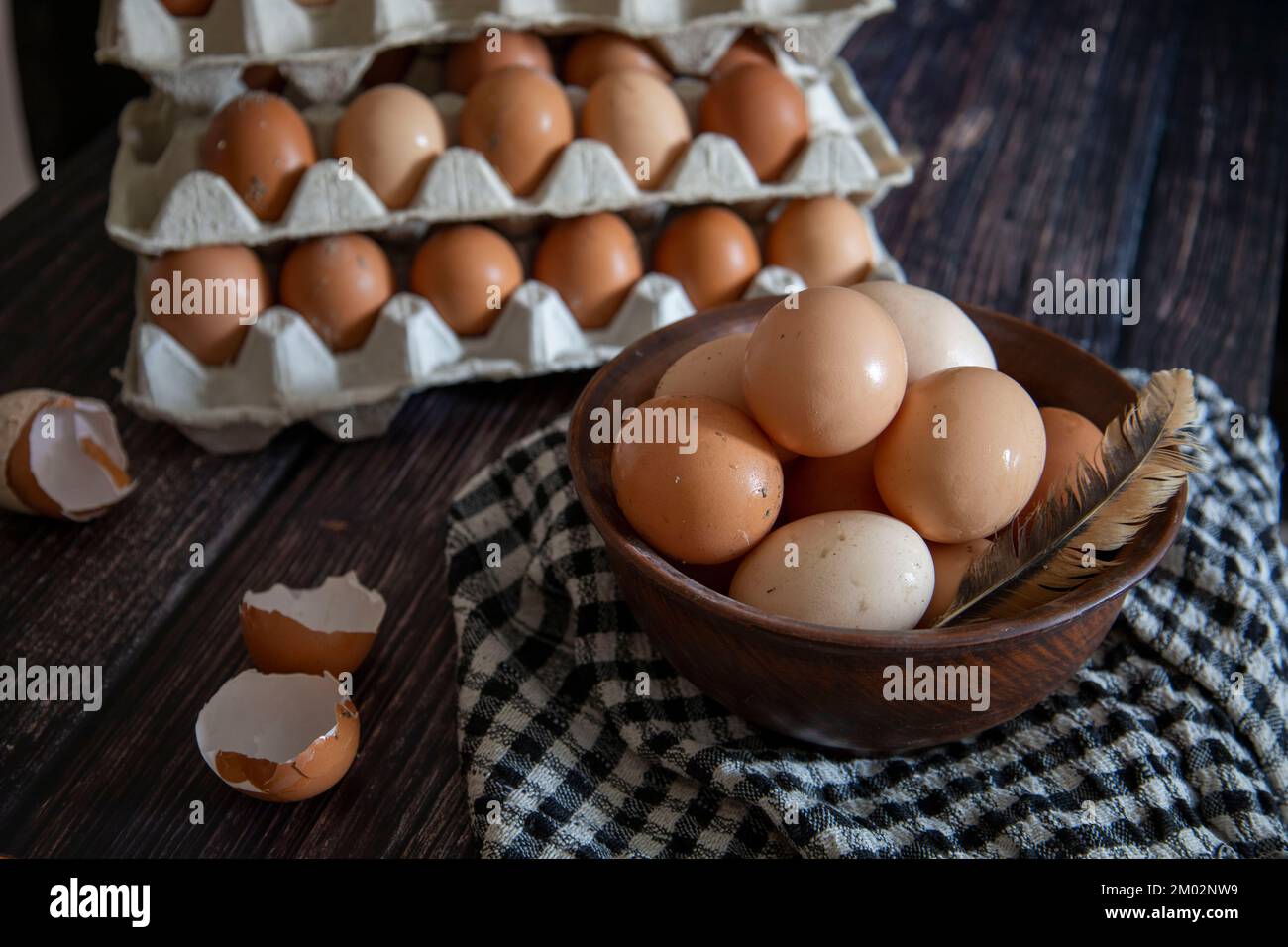 Chicken eggs in a clay plate and trays on the table Stock Photo - Alamy