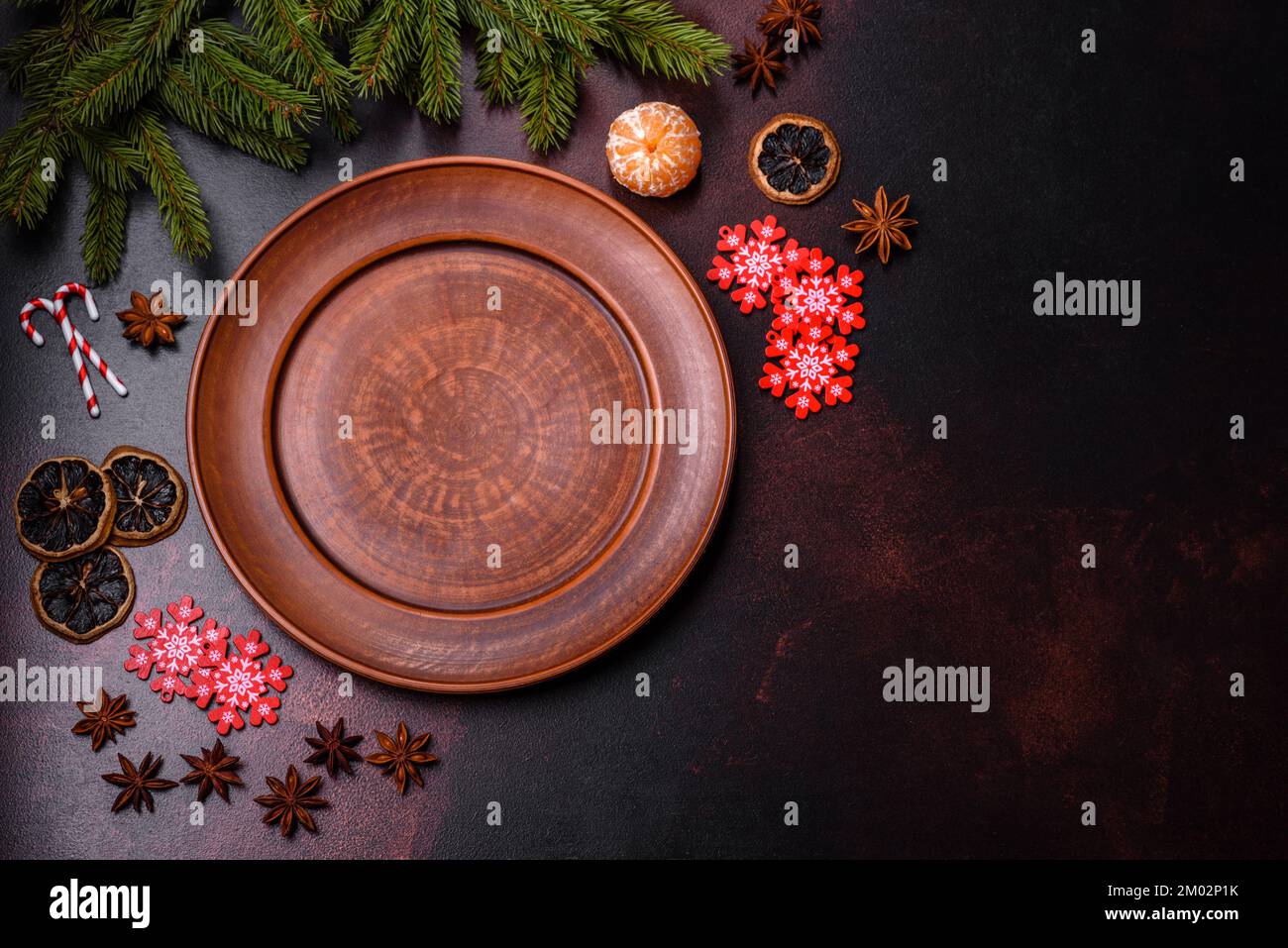 Christmas table with empty plate and surface with New Year's ...