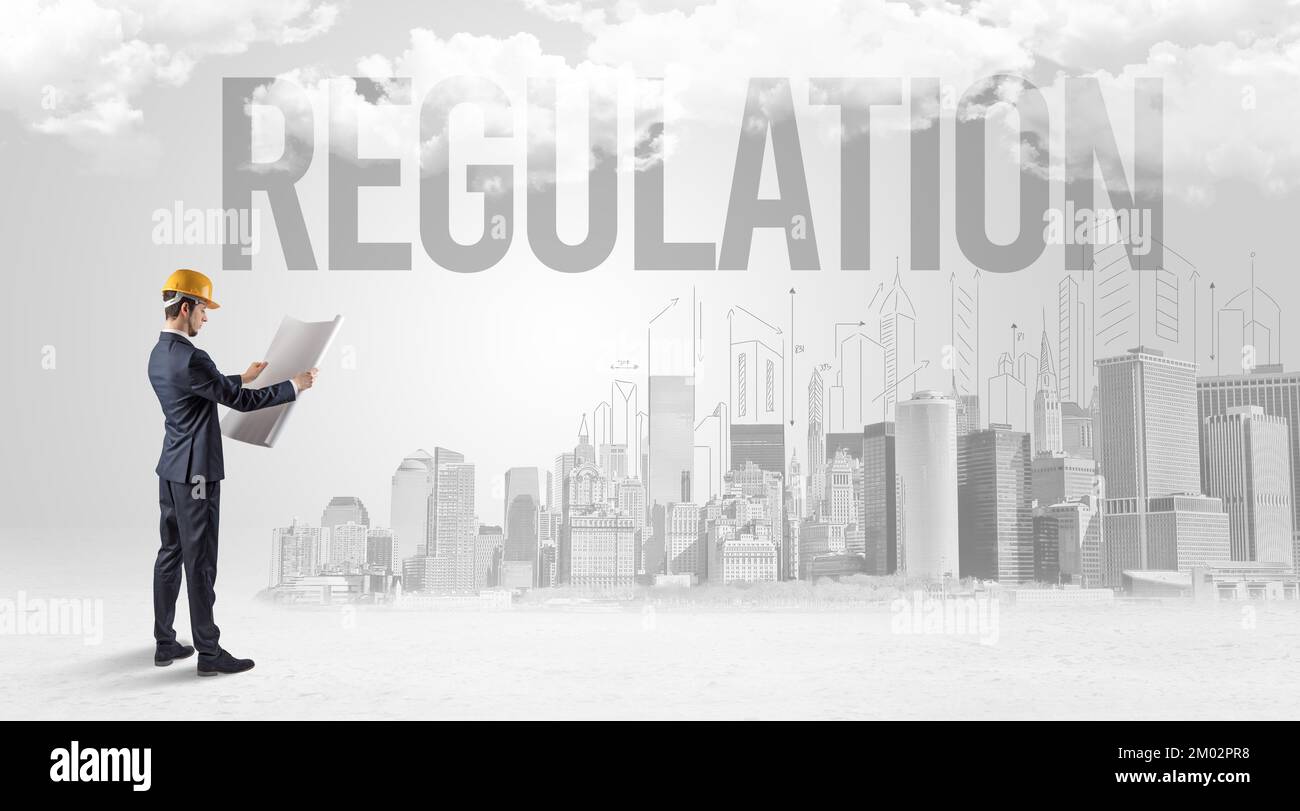 Young businessman with hard hat Stock Photo - Alamy