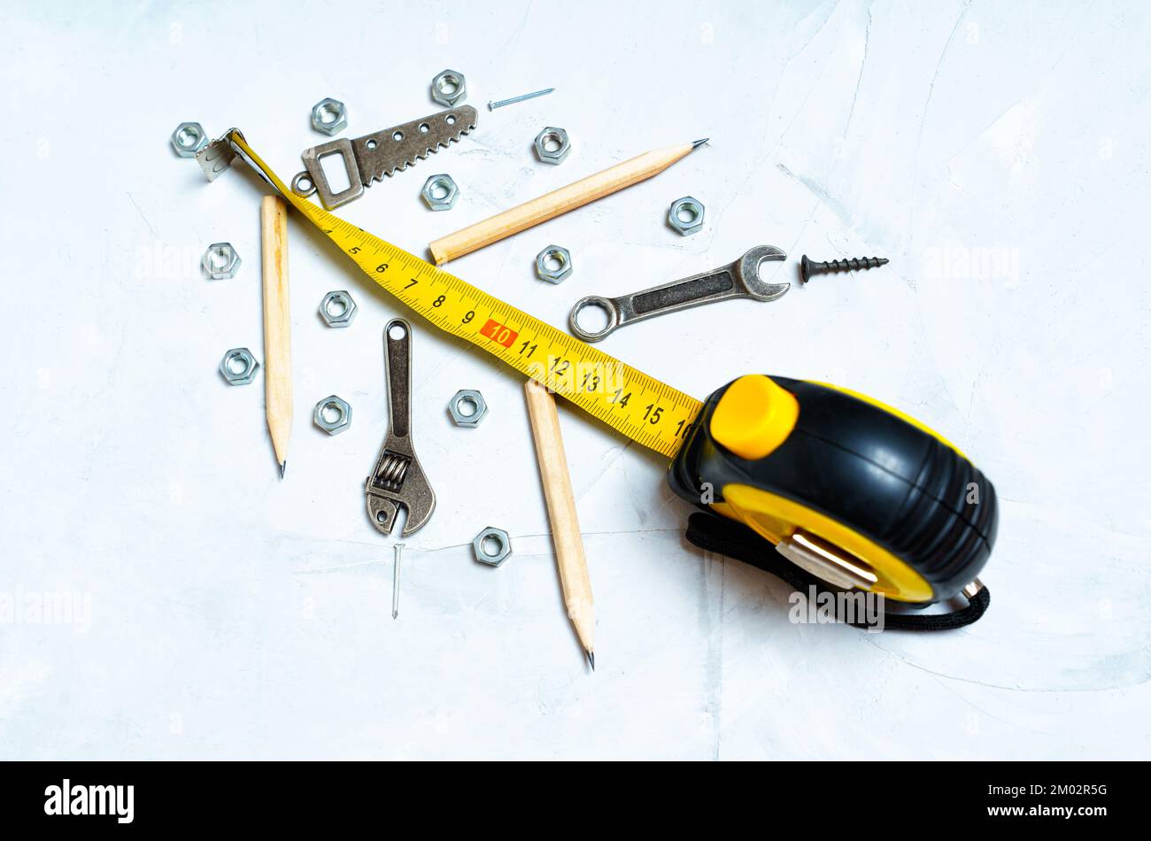 Yellow roll meter, miniature copies of essential construction tools and ...
