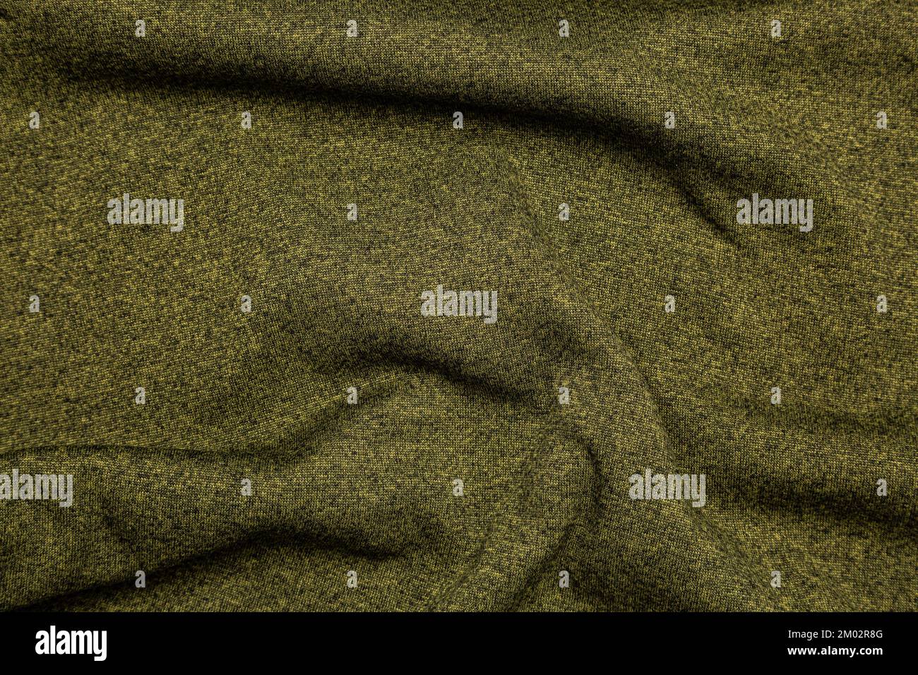 Texture of knitted fabric in green color. Light khaki background Stock ...