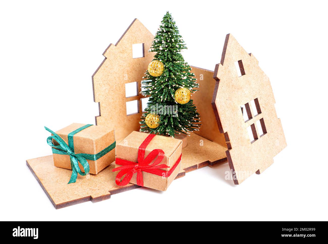 Christmas tree figurine and wrapped presents placed inside a ...