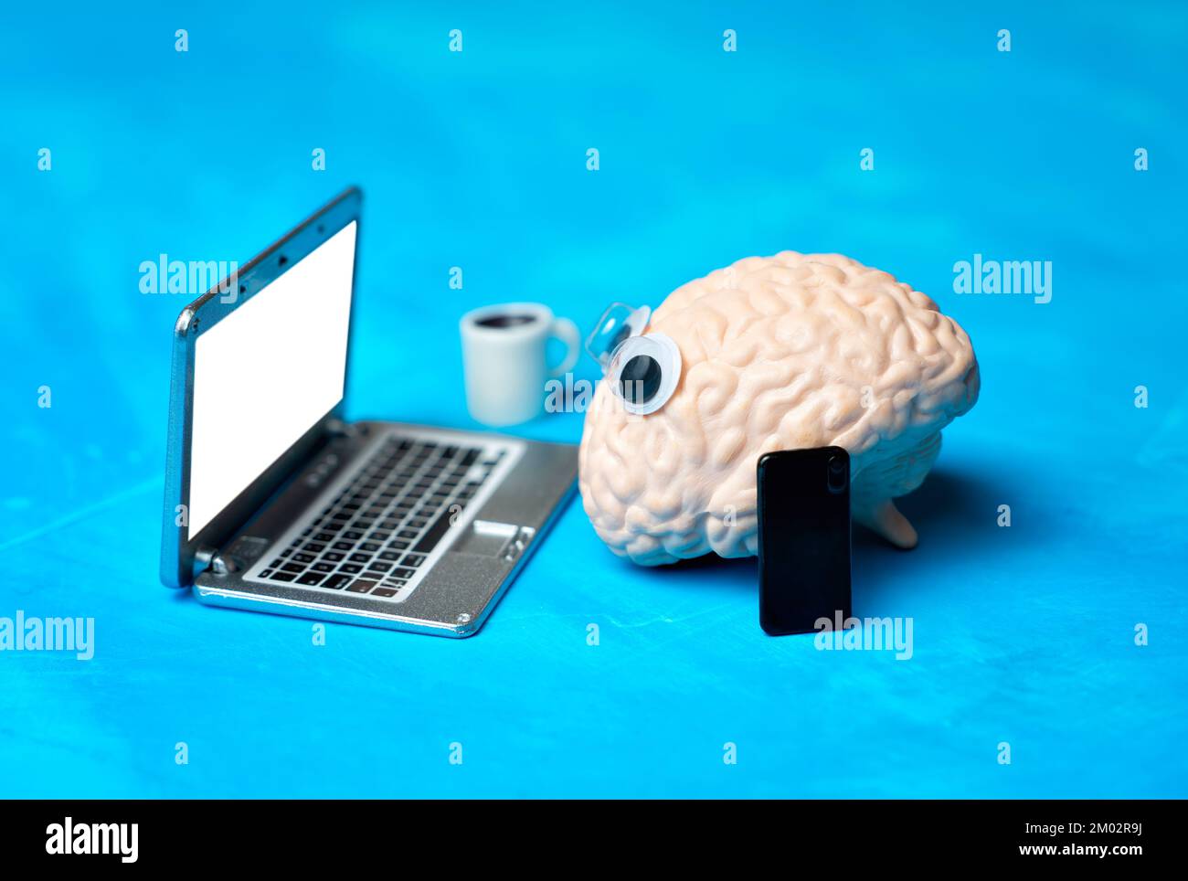 Anatomical copy of a human brain with googly yes working on a miniature ...
