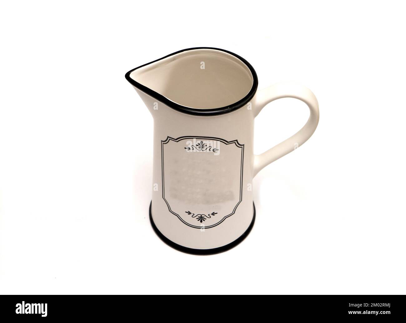 White metal milk pitcher. Isolated on white background Stock Photo - Alamy